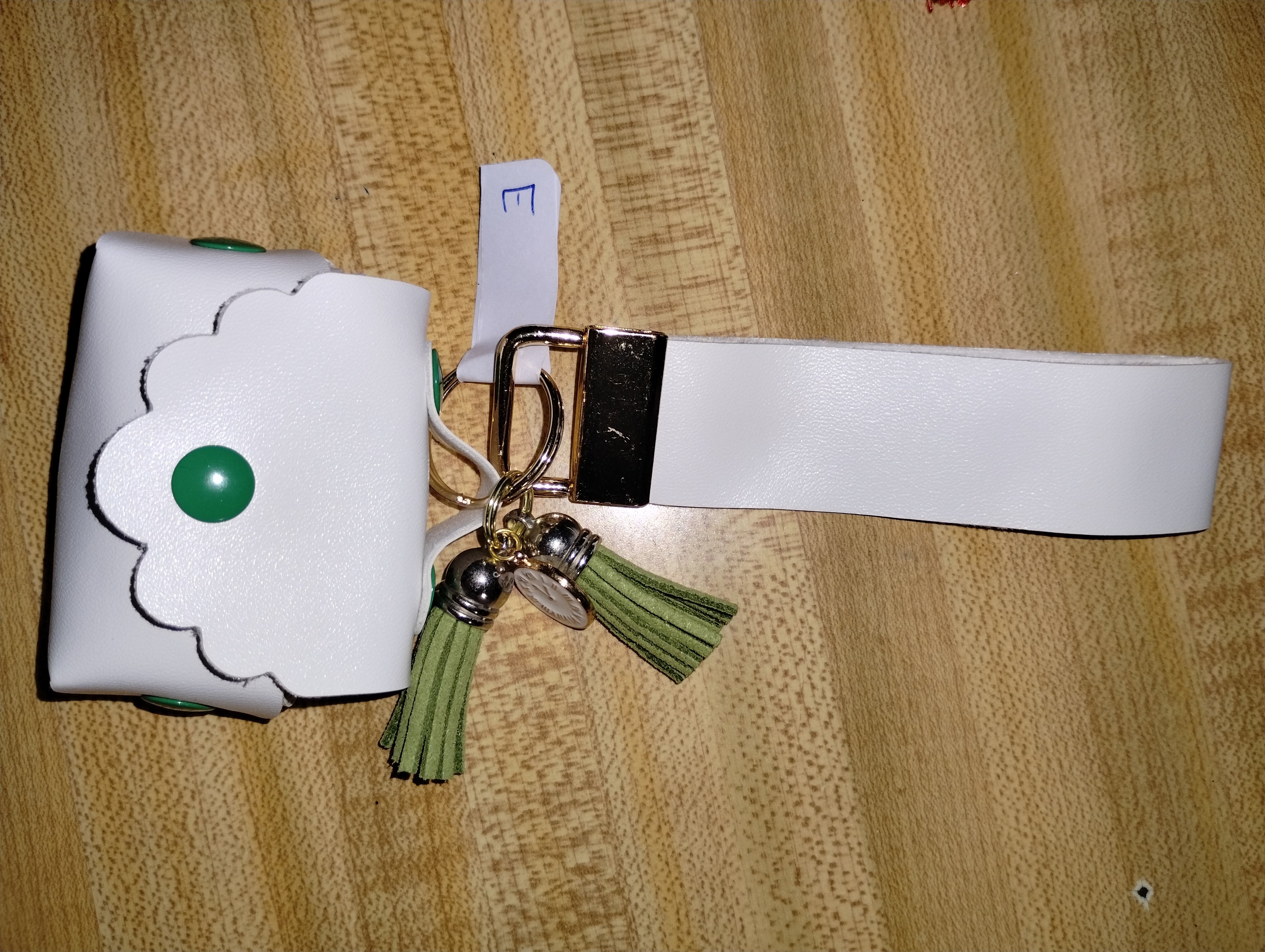 Item E White Air Pod Pro case with green tassles and charm - Payhip