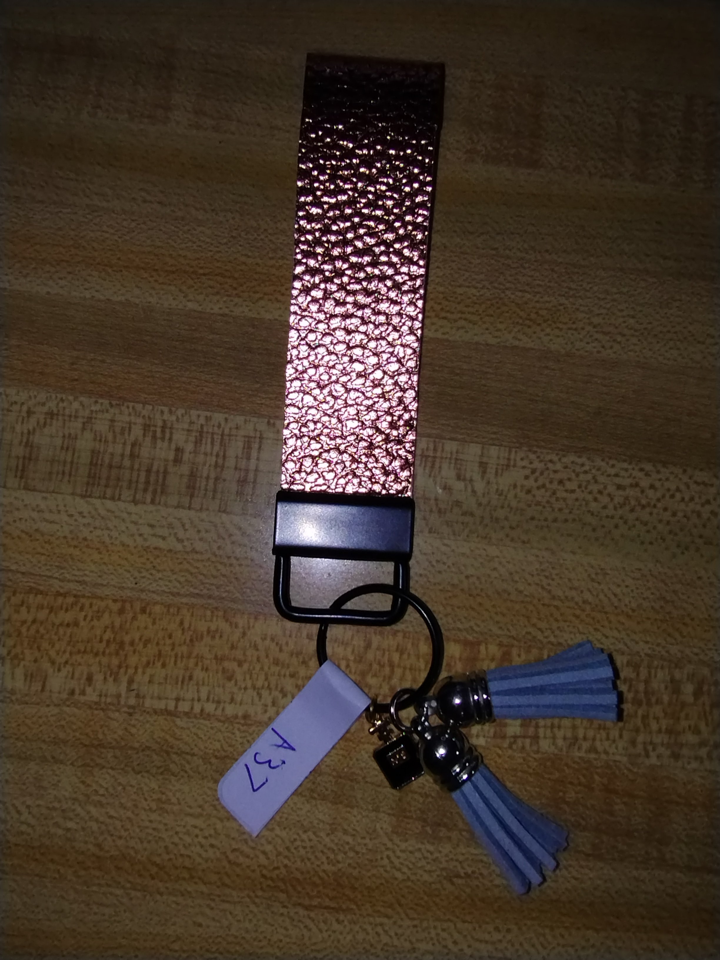 Item A37 Copper lanyard with teal tassles and a charm. - Payhip