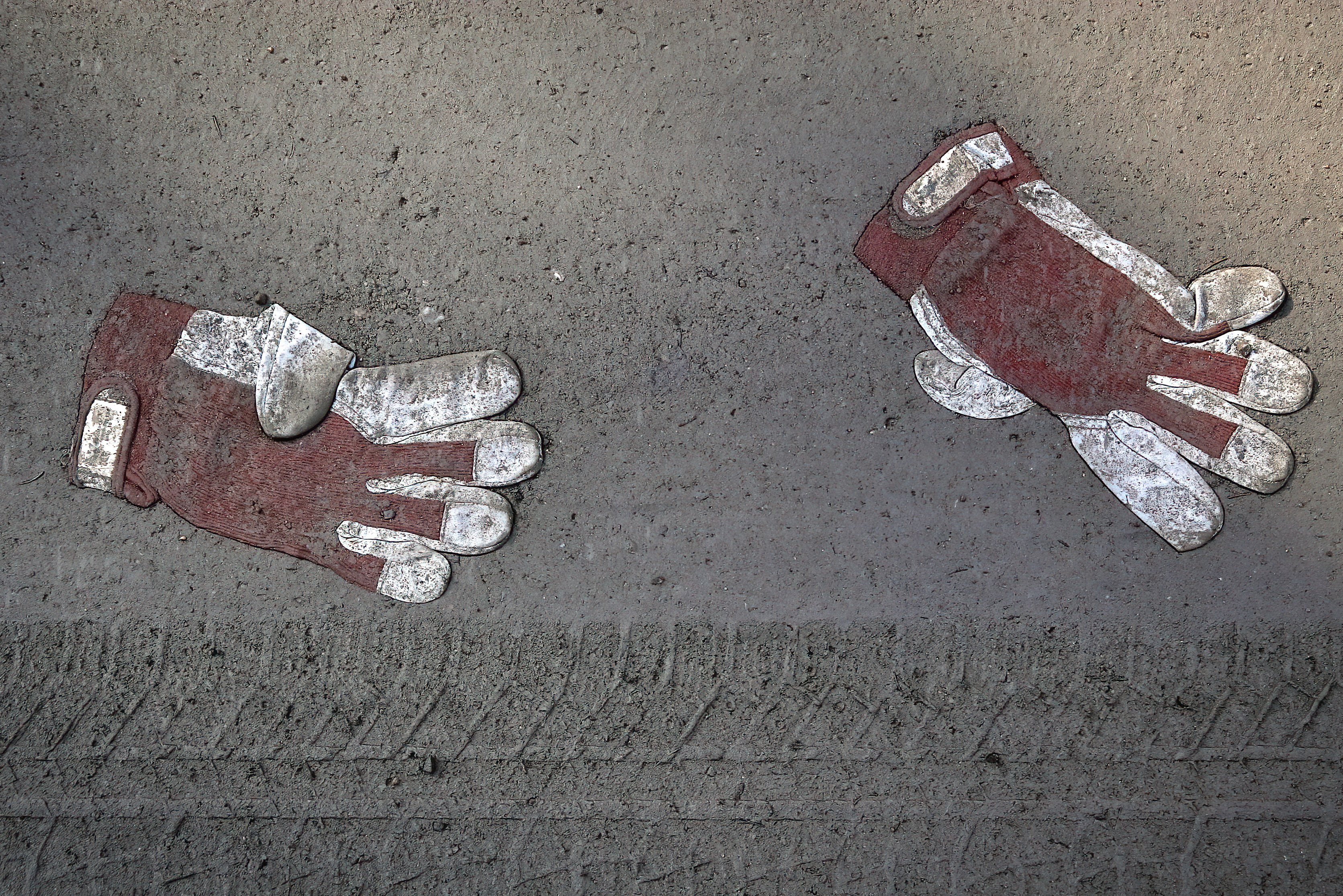 Someone has dropped work gloves on the road. - Payhip