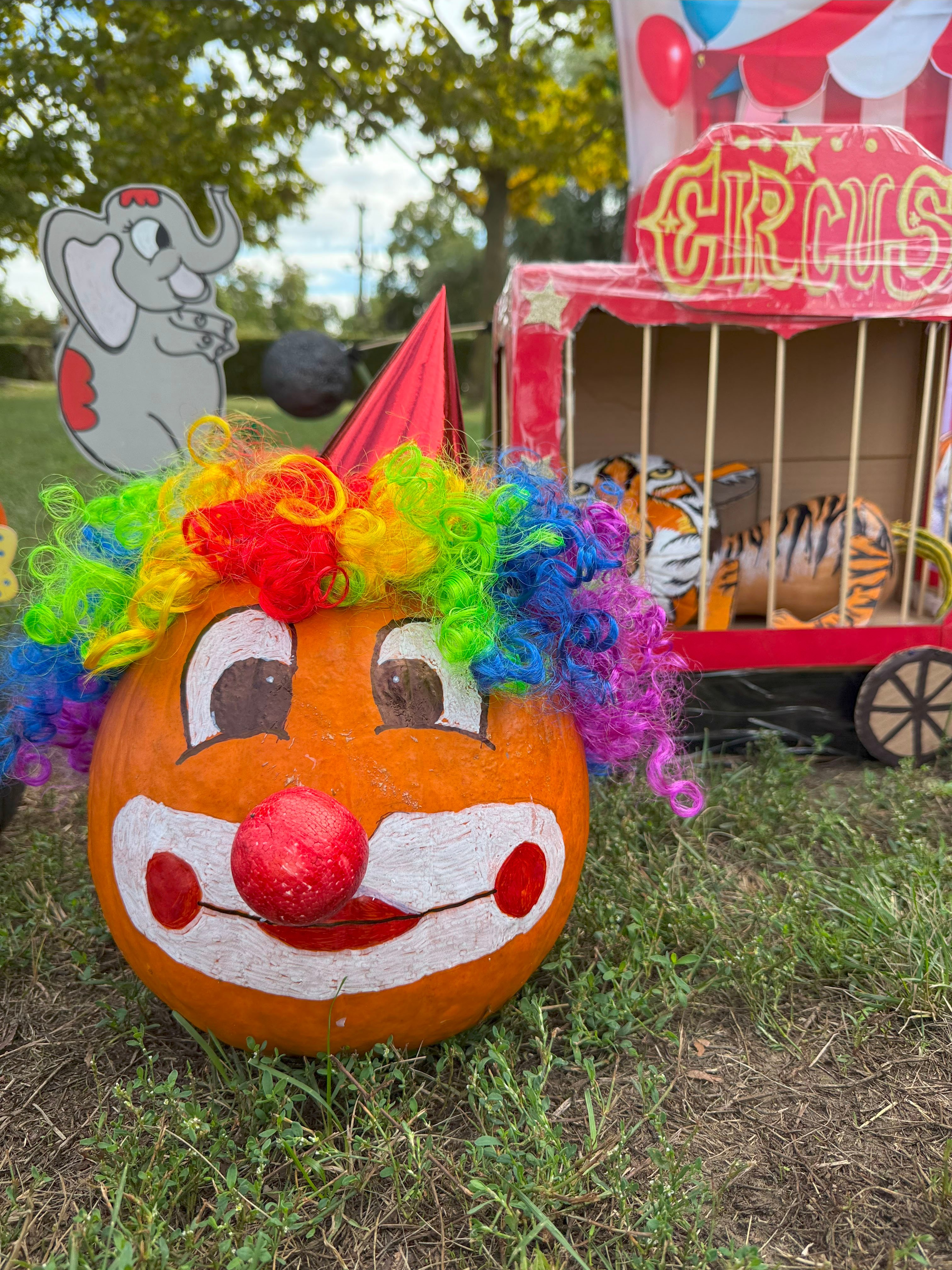 Pumpkin clown head lying on grass for Halloween - Payhip
